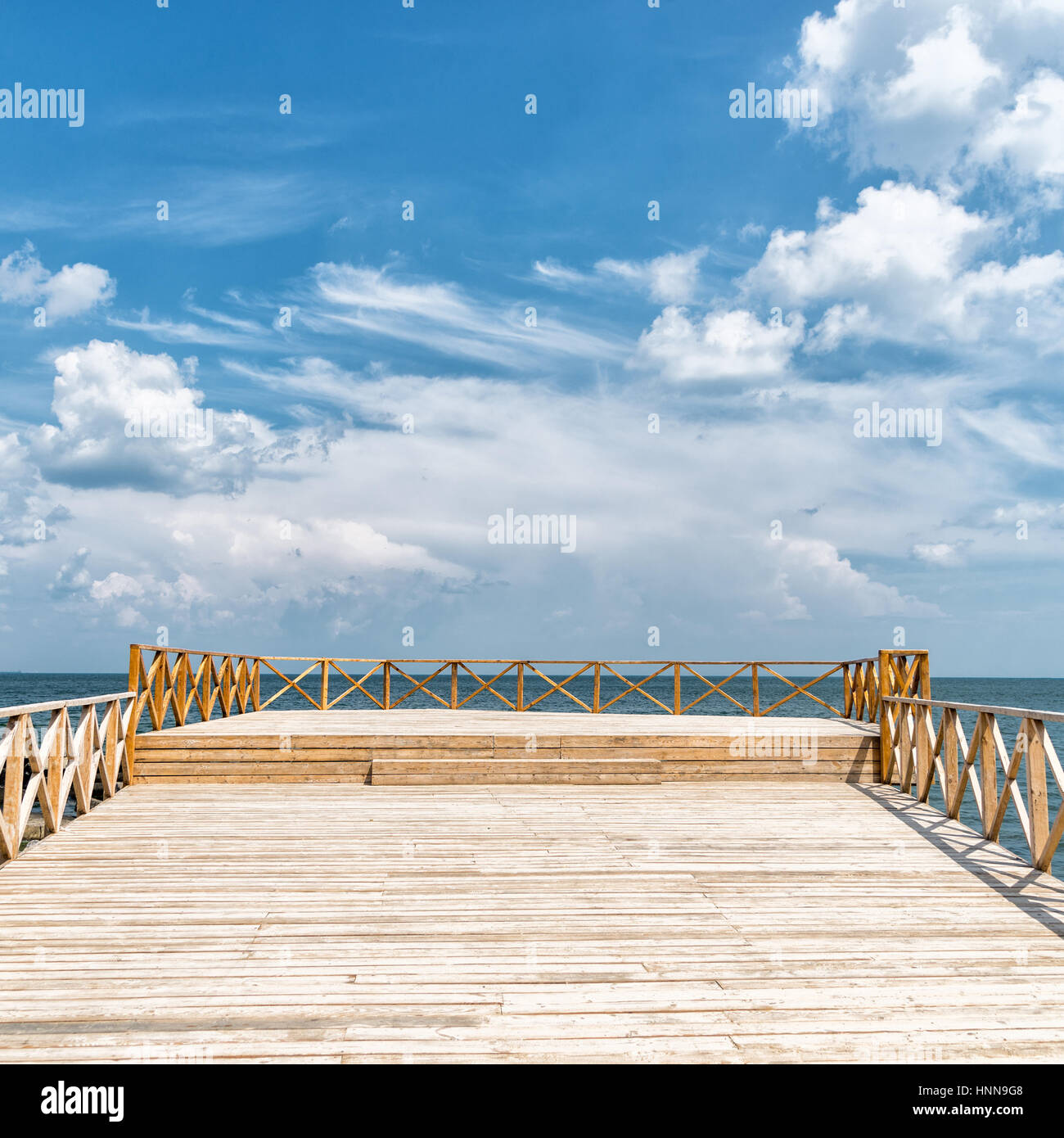 Wooden pier with blue sea Stock Photo - Alamy