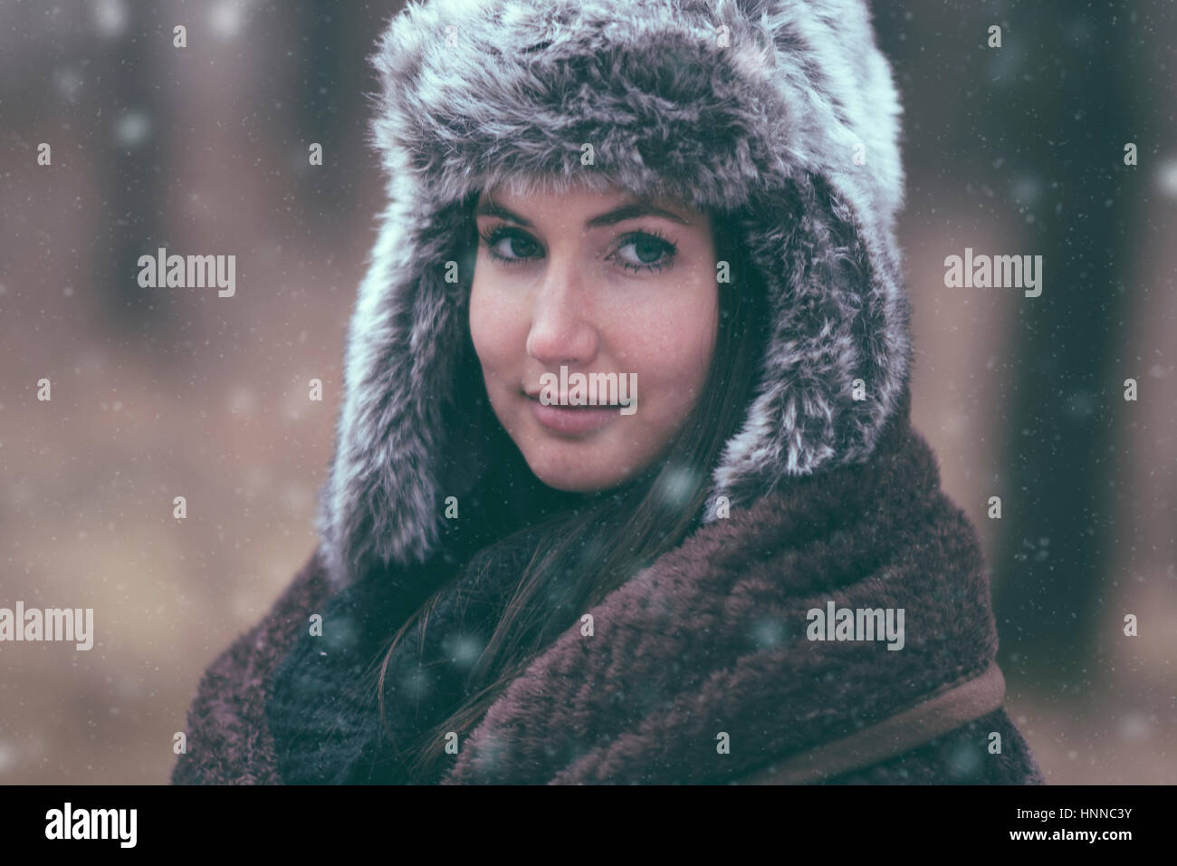 Woman in snowfall Stock Photo - Alamy