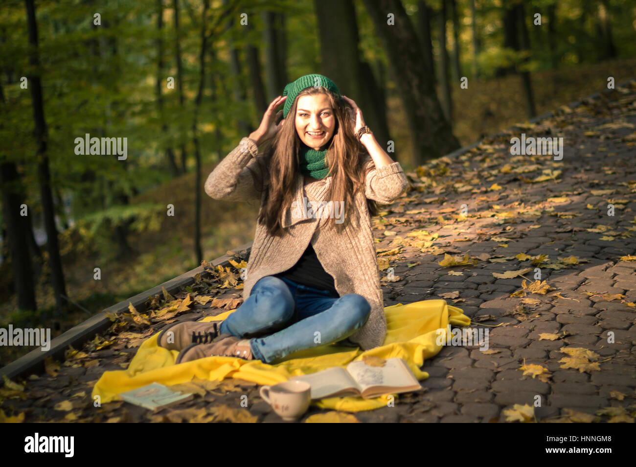 girl sitting on the track Stock Photo - Alamy