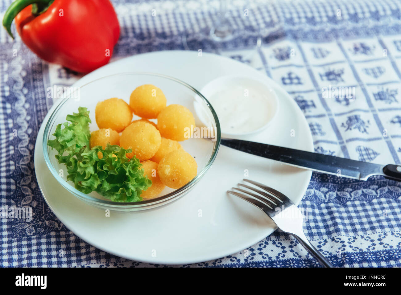 Deep fried cheese balls with lettuce and sauce Stock Photo - Alamy