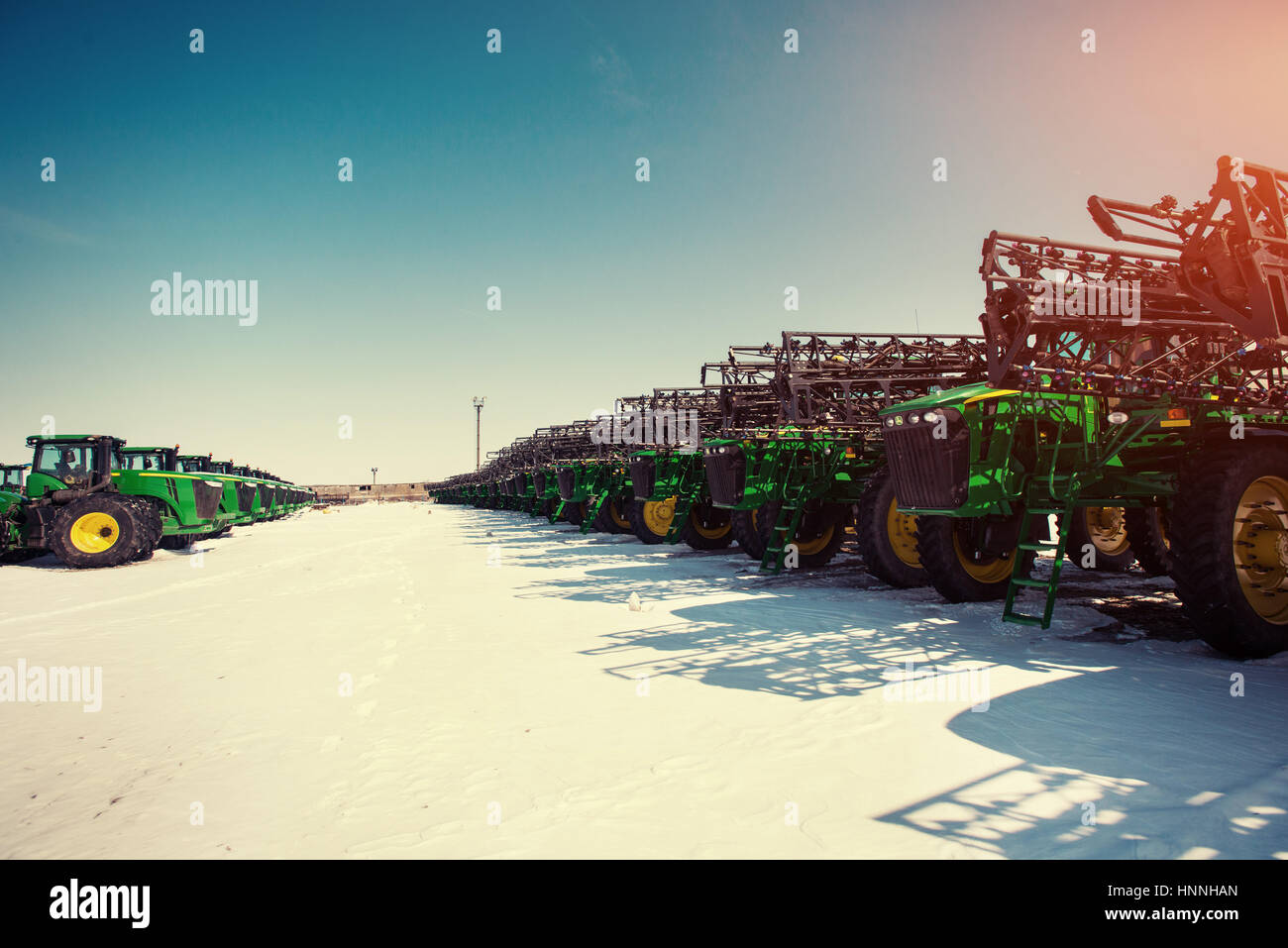 Several tractors lined up in the agricultural sector Stock Photo - Alamy