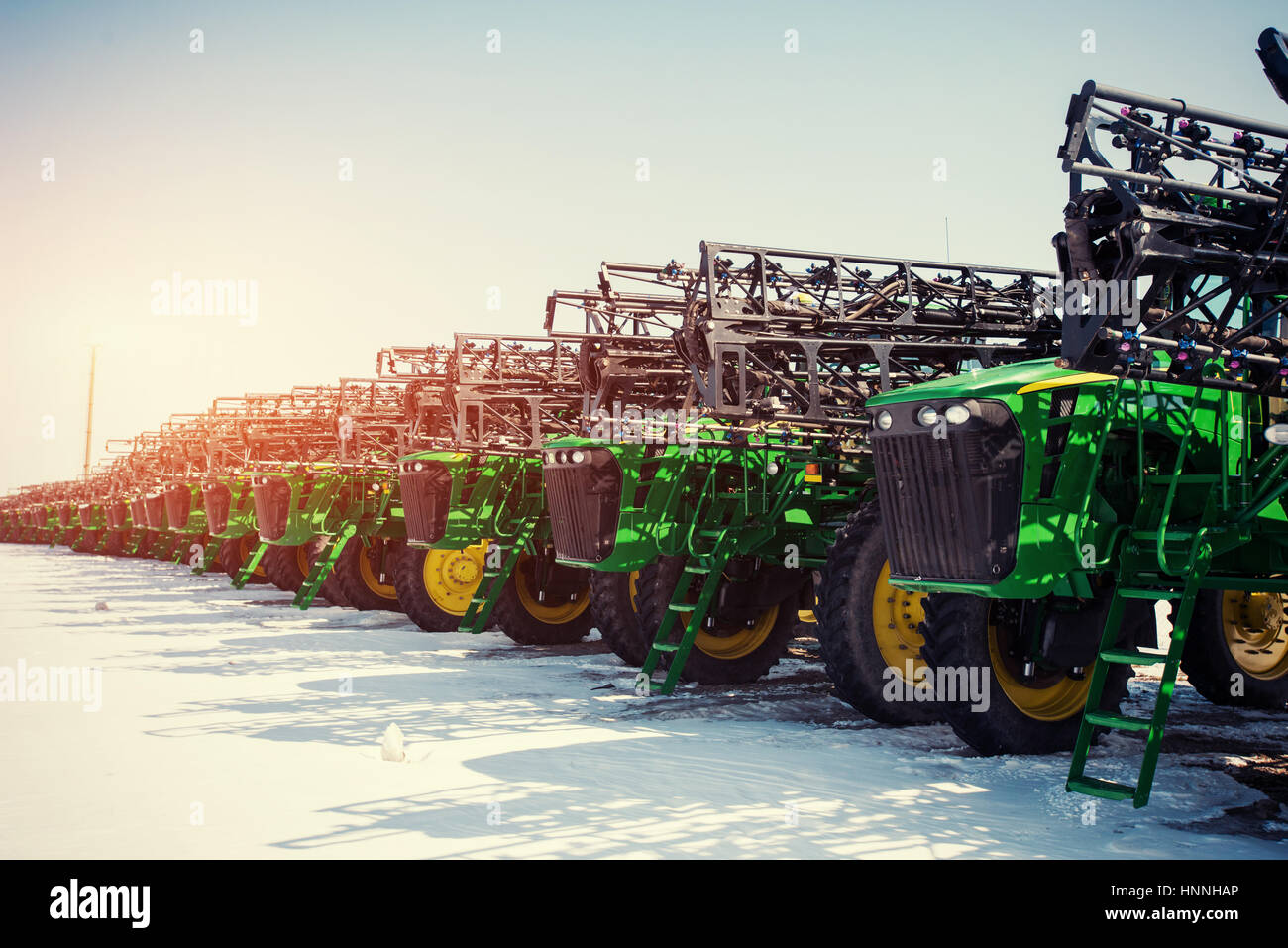 Several tractors lined up in the agricultural sector Stock Photo - Alamy
