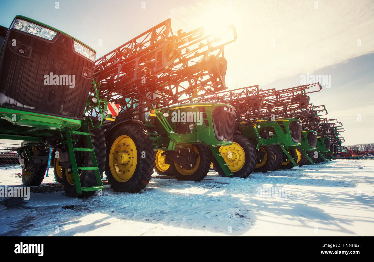 Several tractors lined up in the agricultural sector Stock Photo - Alamy