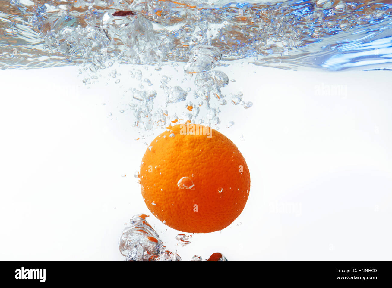 orange in spray of water with splash on white background Stock Photo ...