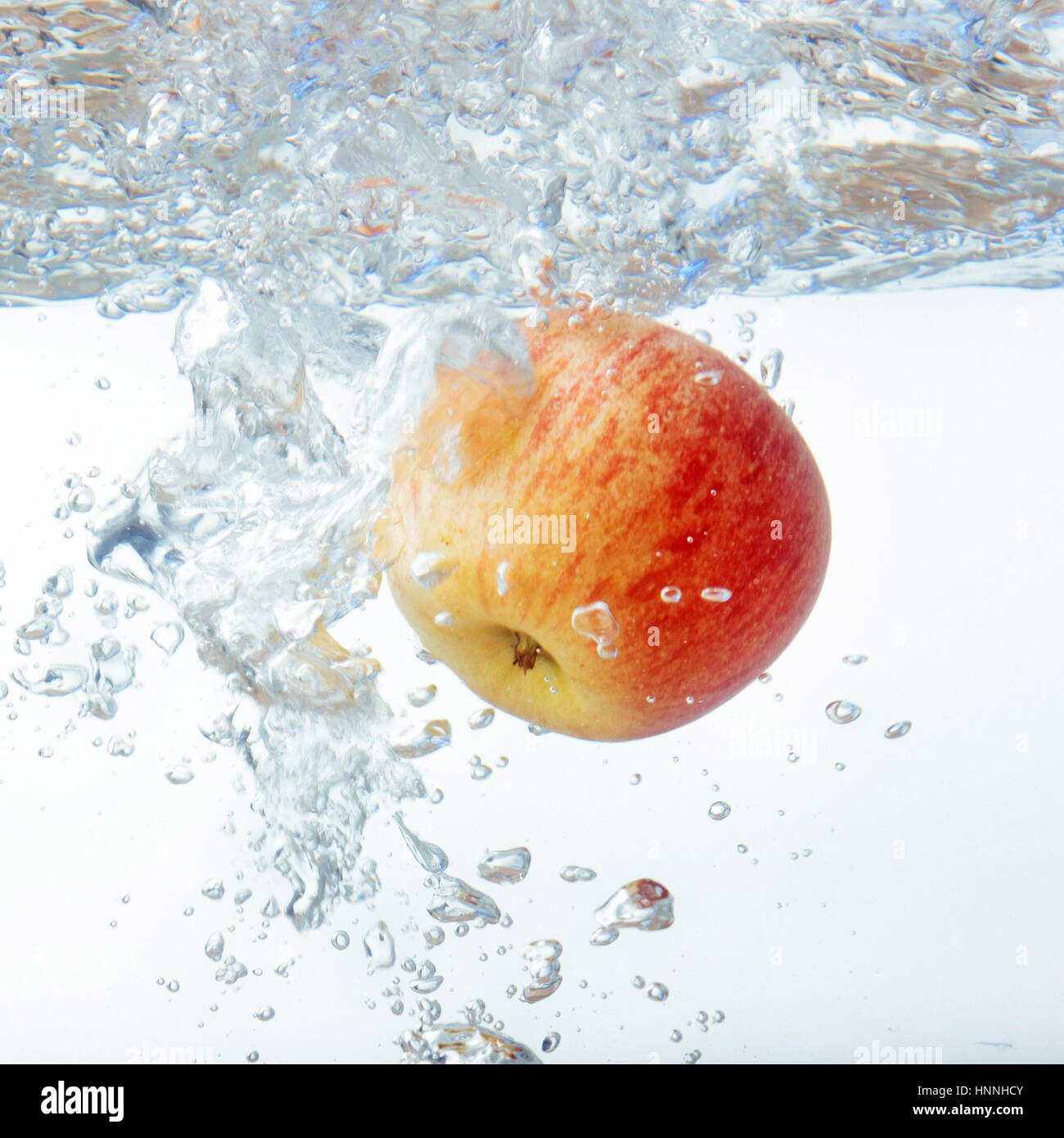 apple in water on a white background Stock Photo - Alamy