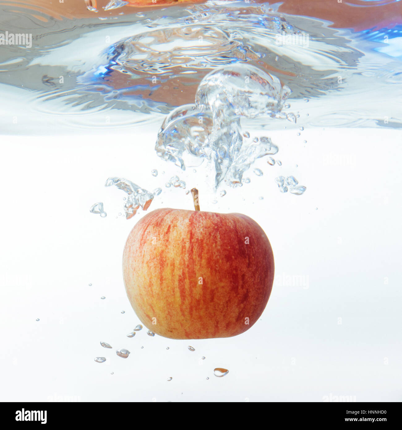apple in water on a white background Stock Photo - Alamy