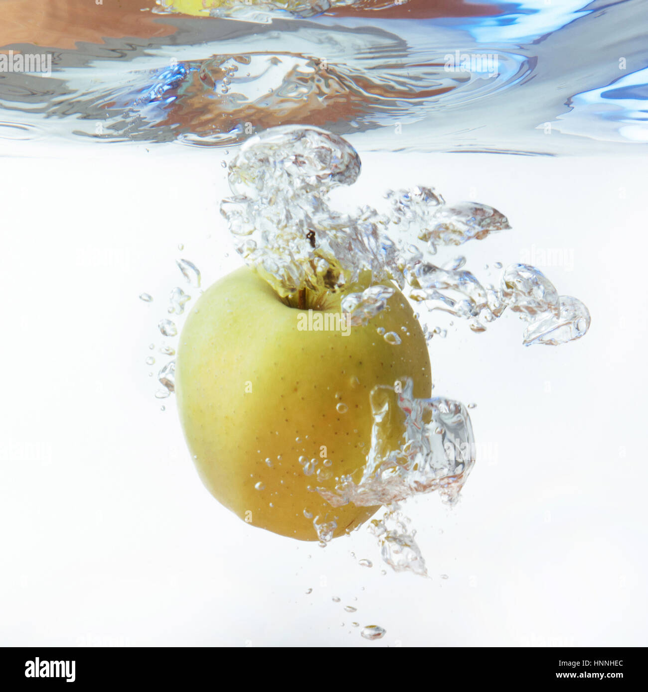 Green apple under water with a trail of transparent bubbles Stock Photo ...
