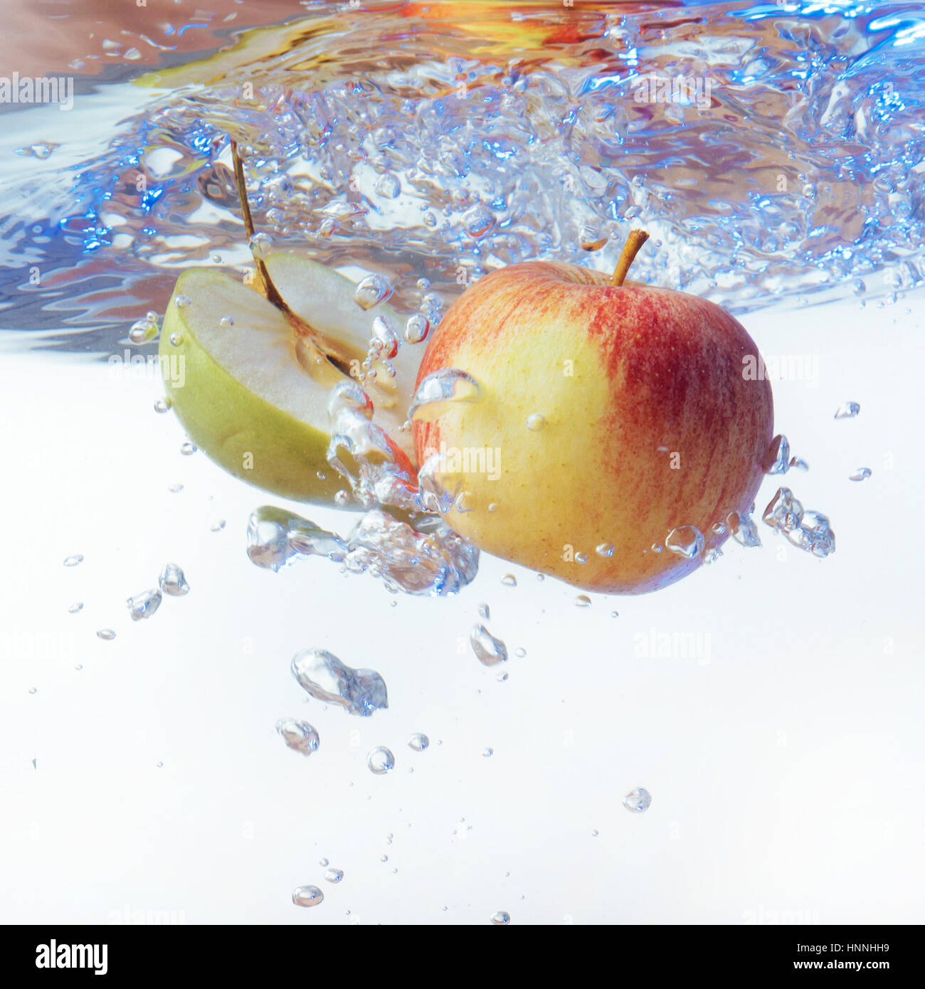apple in water on a white background Stock Photo - Alamy