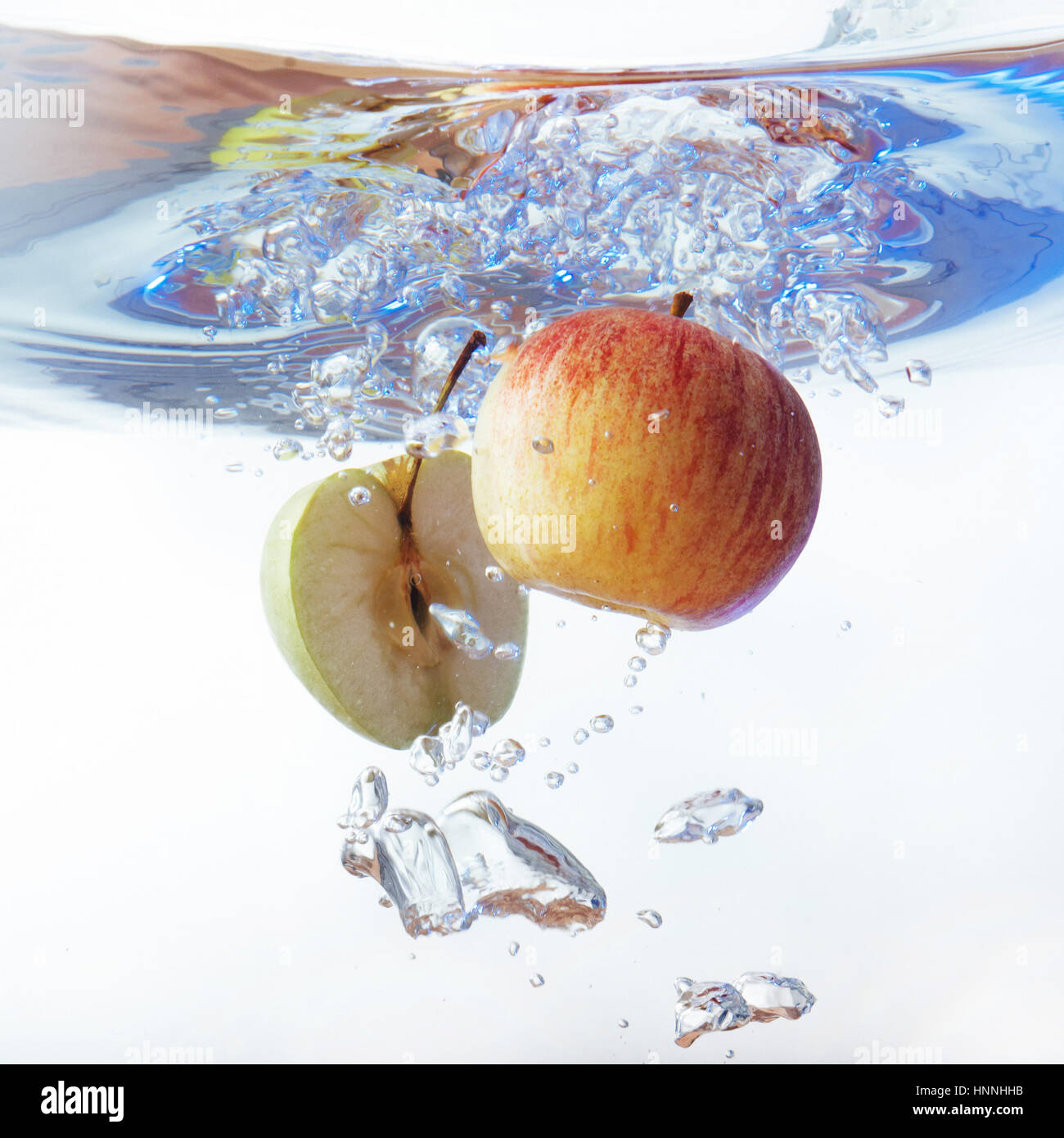 apple in water on a white background Stock Photo - Alamy