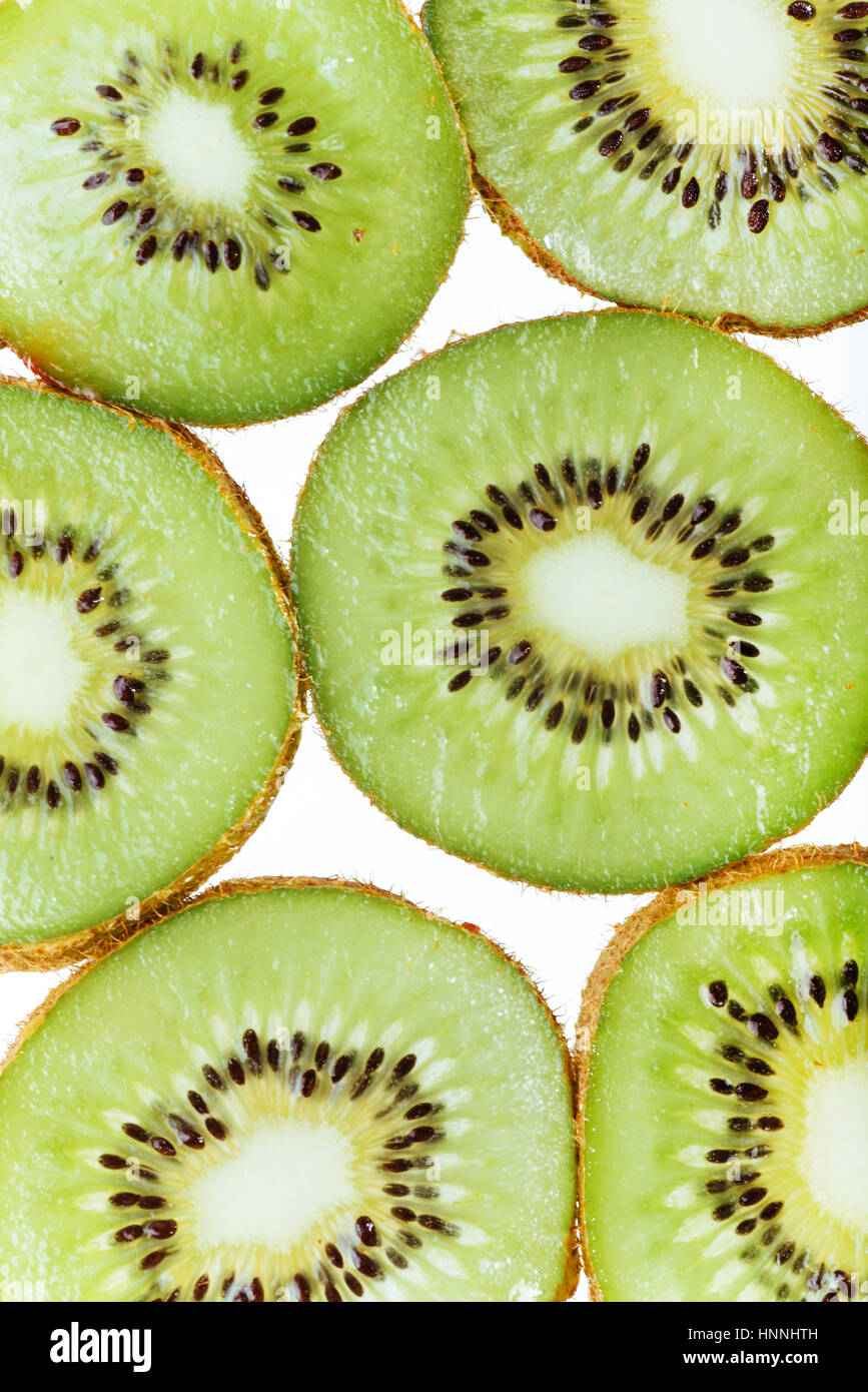 Whole kiwi fruit and his sliced segments isolated Stock Photo - Alamy