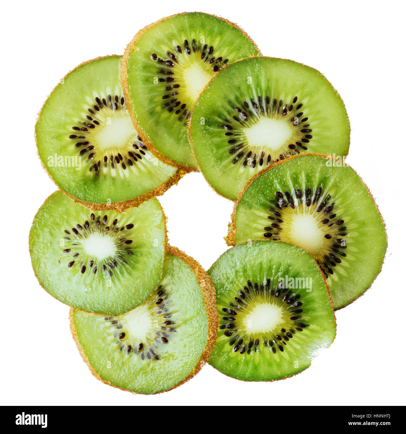 Whole kiwi fruit and his sliced segments isolated Stock Photo - Alamy