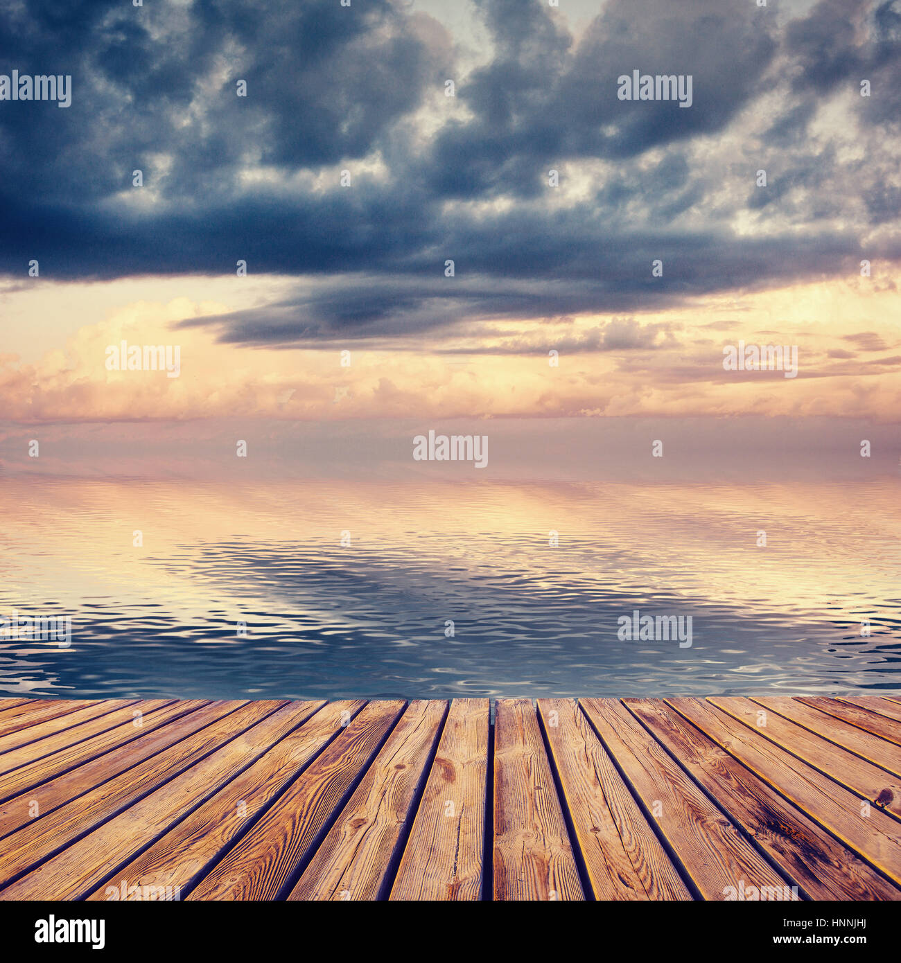 Beautiful sunset over sea with reflection in water, majestic clo Stock ...