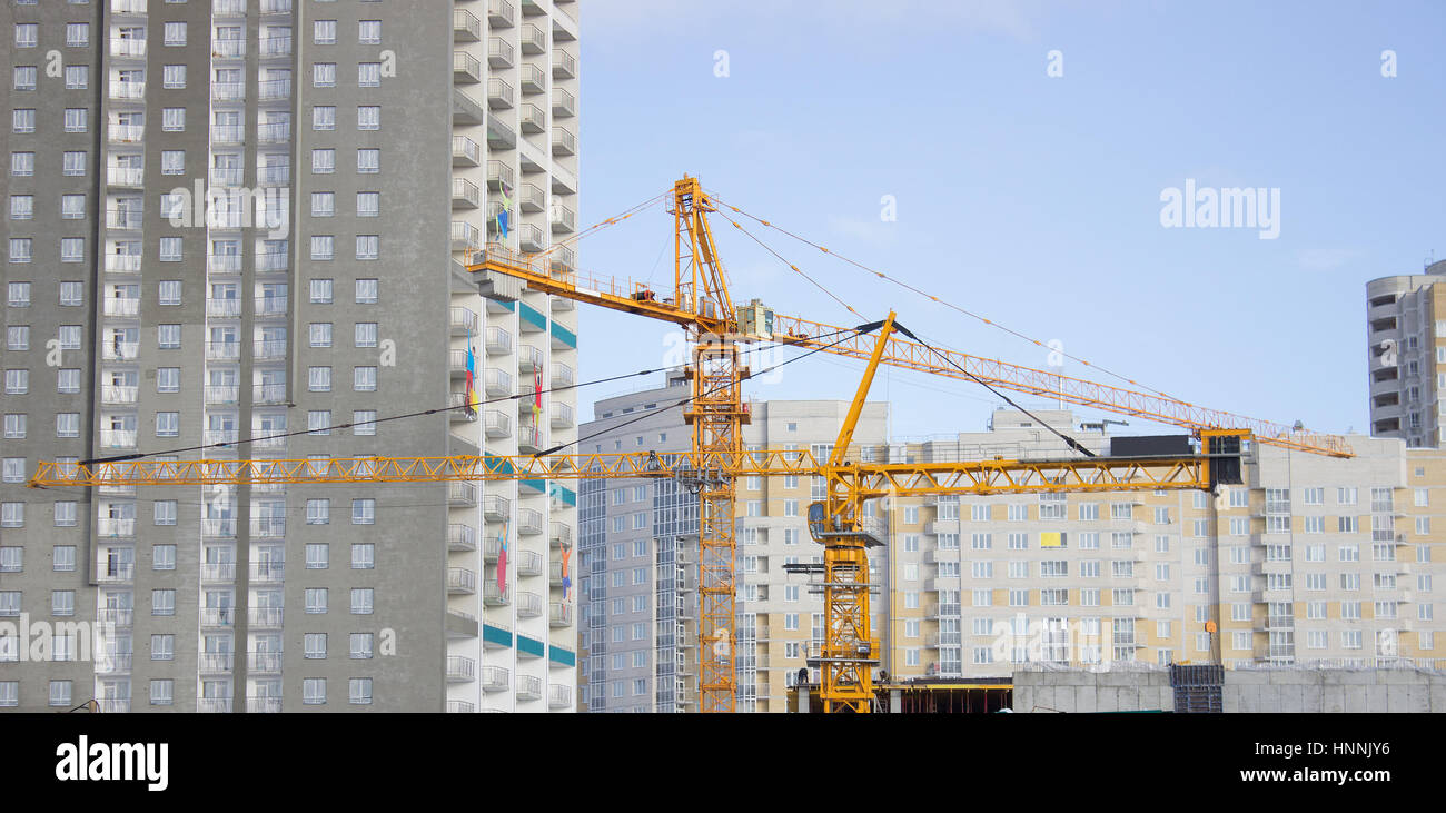 Construction cranes used in the construction of multi-storey buildings ...