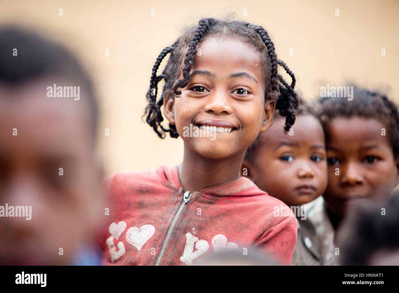 Smiling portrait of a little girl taken in rural fisherman's community ...