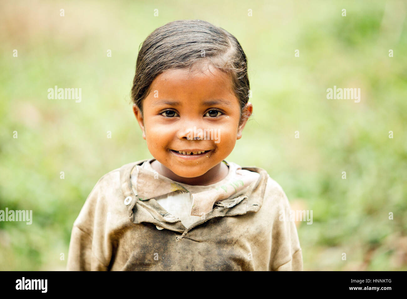 Smiling portrait of a little girl taken in rural fisherman's community ...