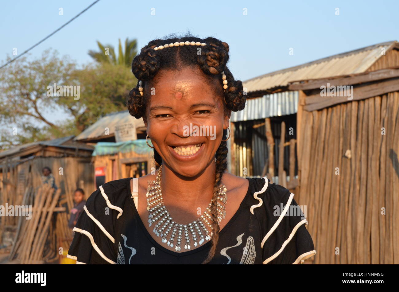 Woman with traditionally painted face/ face tattoo and braided hair in ...