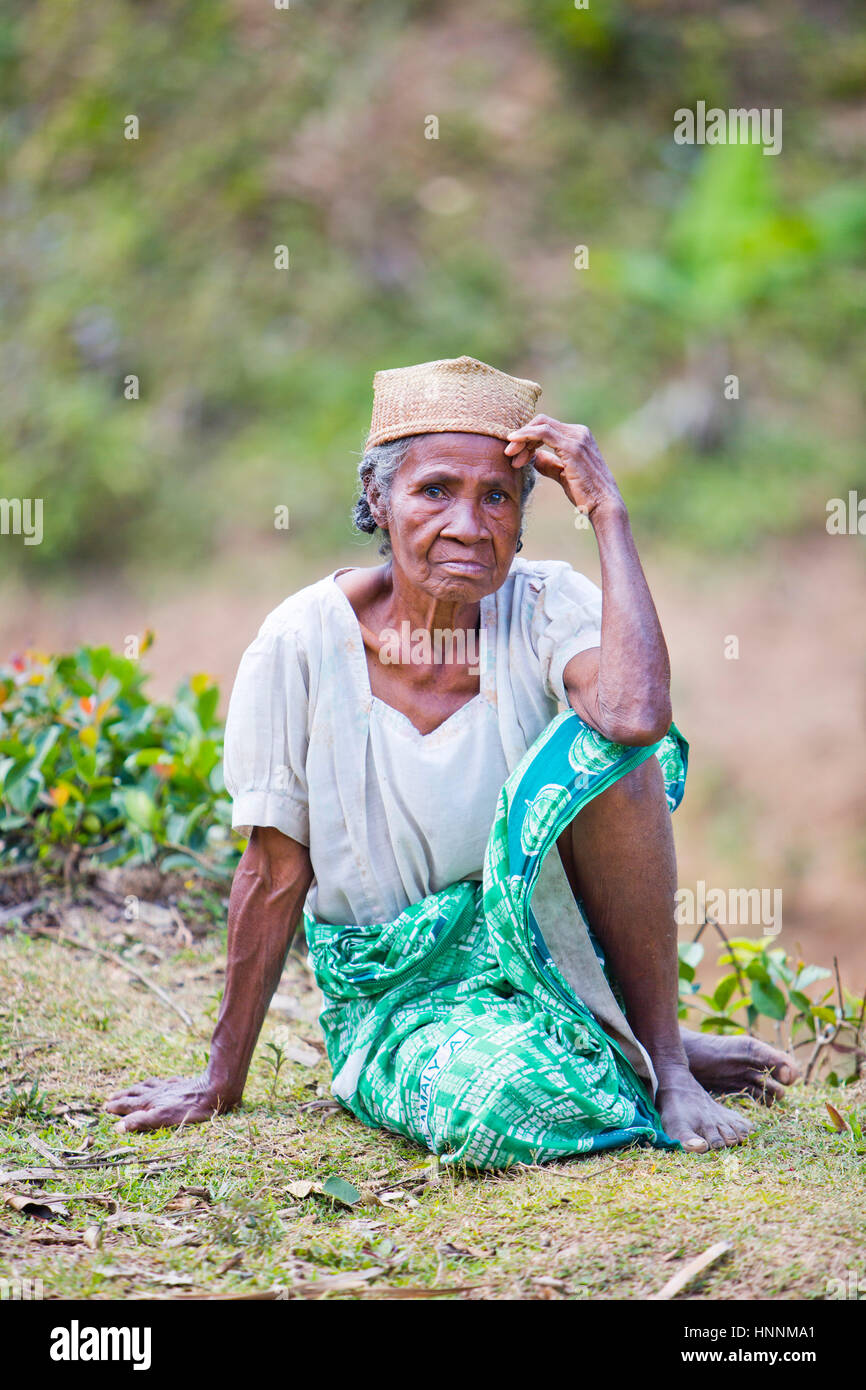 Portrait of old malagasy woman sitting on the ground Stock Photo - Alamy