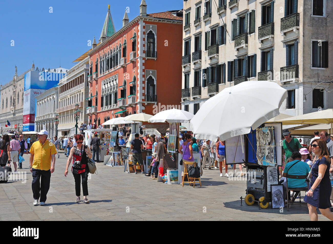 Street sellers selling souvenirs along Venice harbour, Italy Stock ...