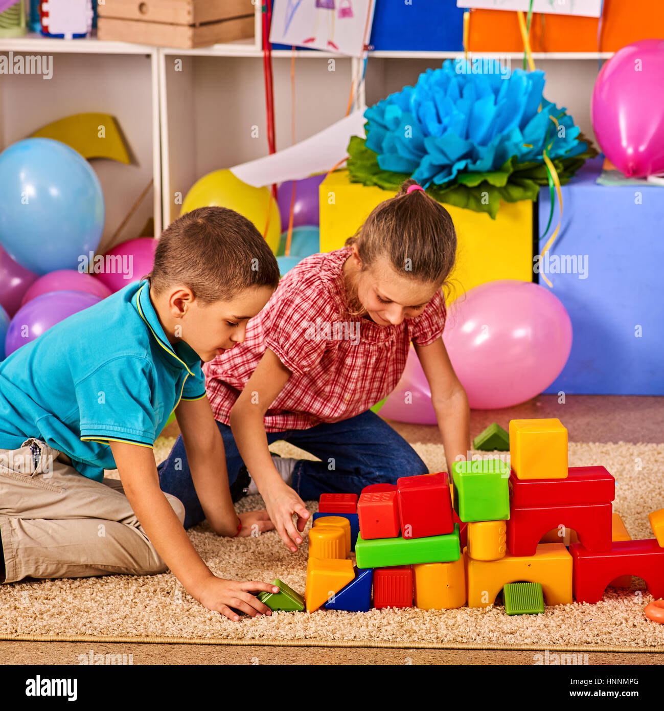 Children playing in kids club indoor. Lesson in primary school Stock ...