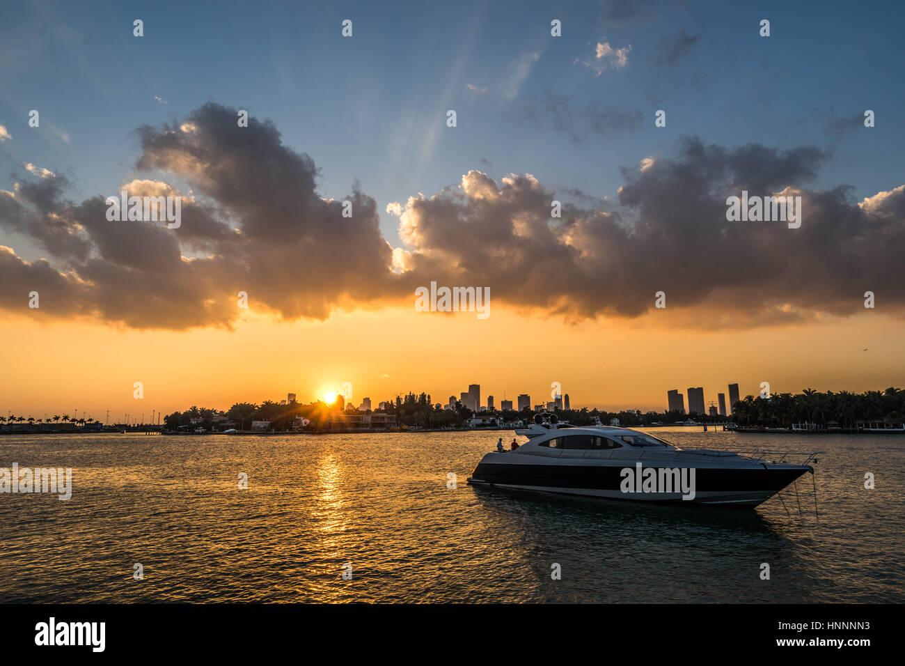 Miami beach sunset! While sailing on a boat passing luxury yacht you ...