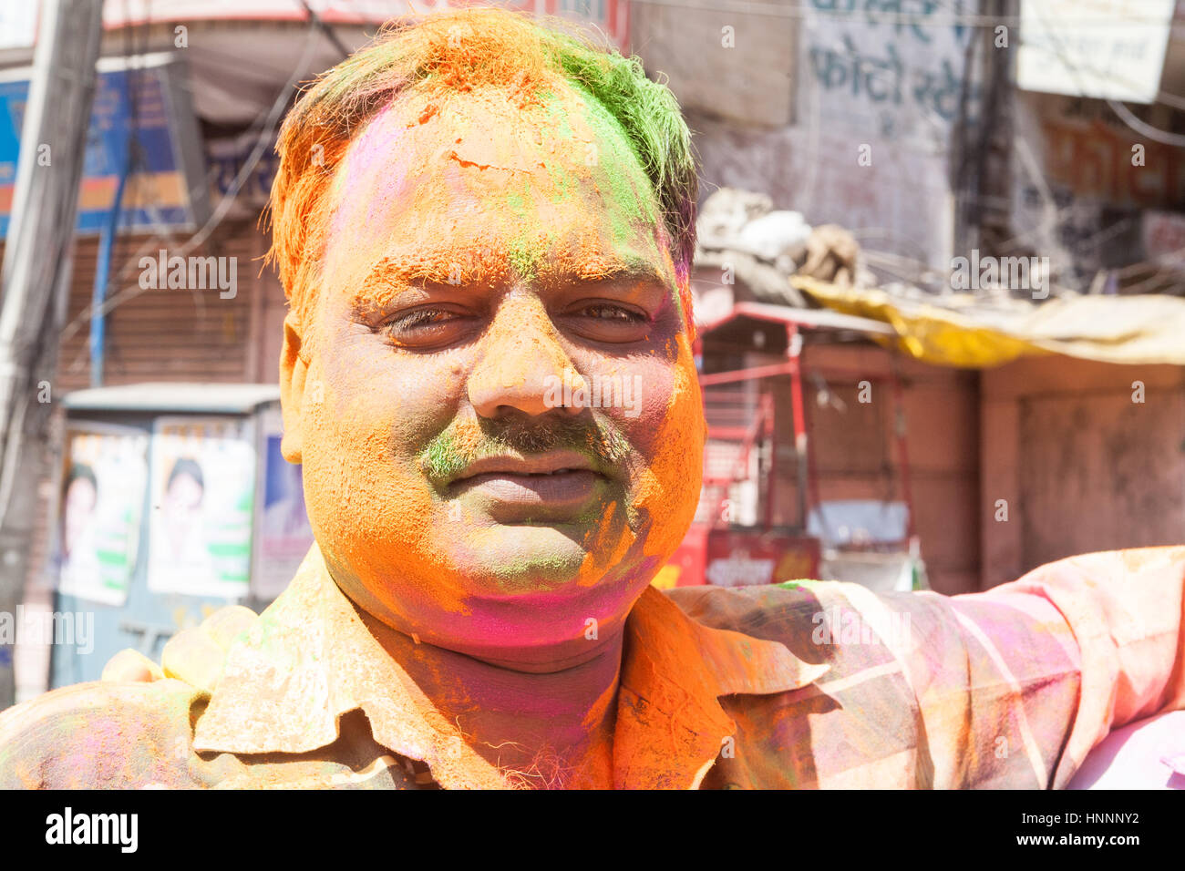 Coloured dye throwing and face smearing of bright coloured powder ...