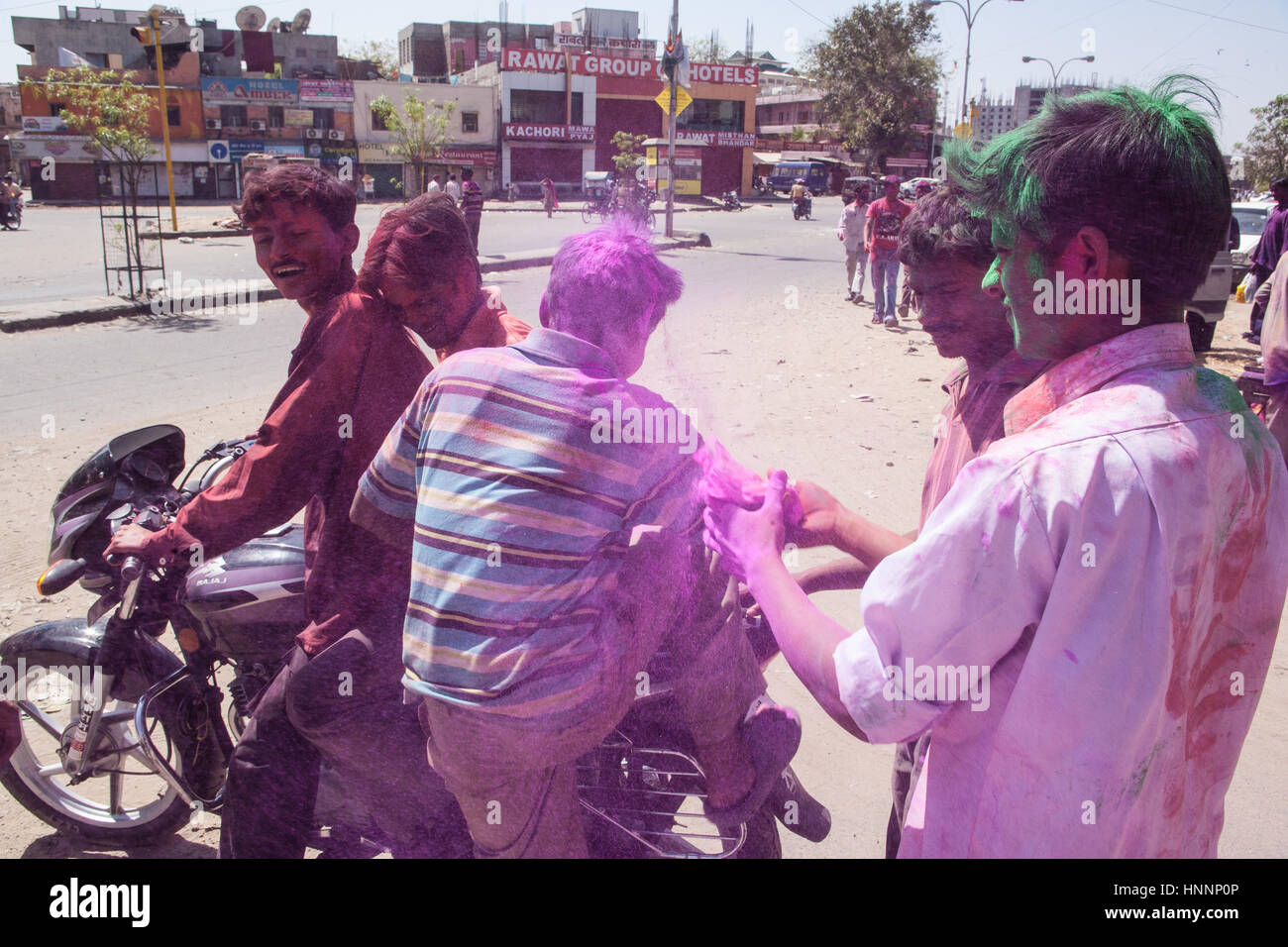 Coloured dye throwing and face smearing of bright coloured powder ...