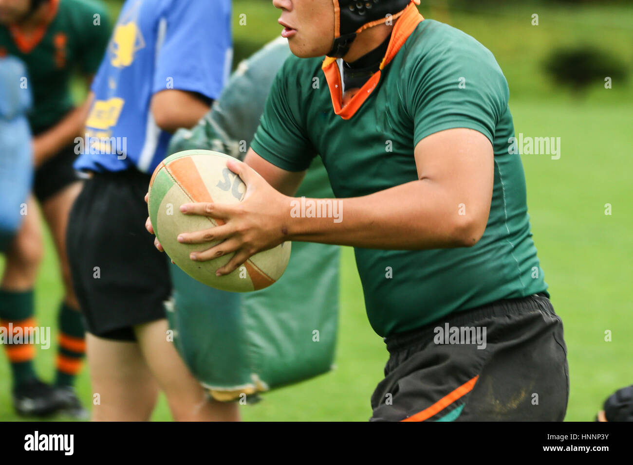 Male student rugby ball hi-res stock photography and images - Alamy