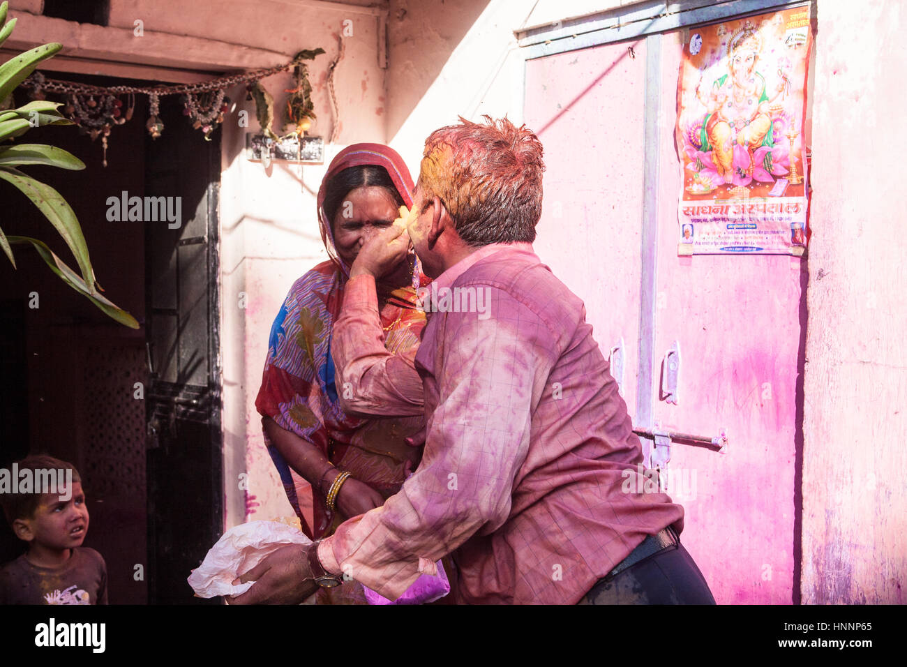 Coloured dye throwing and face smearing of bright coloured powder ...