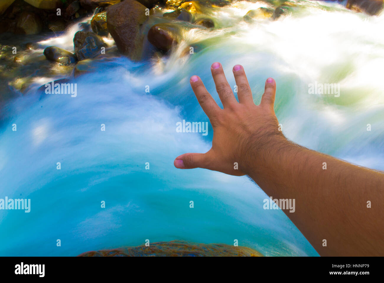 From above view of a hand with a blue river as background Stock Photo ...