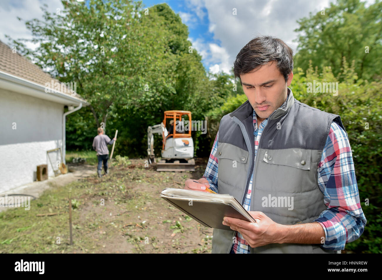 Foreman holding paper pen hi-res stock photography and images - Alamy