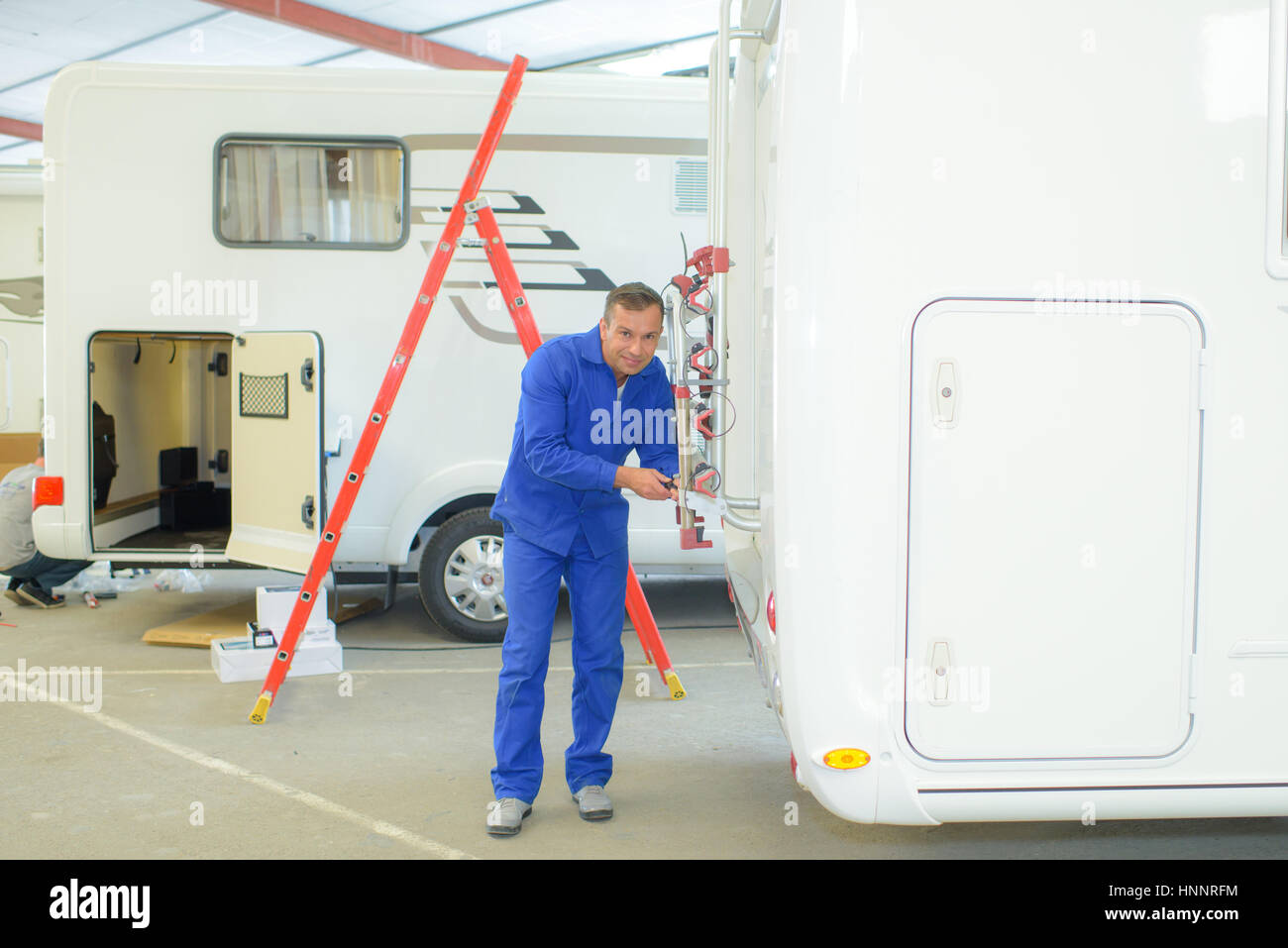 caravan garage worker Stock Photo - Alamy