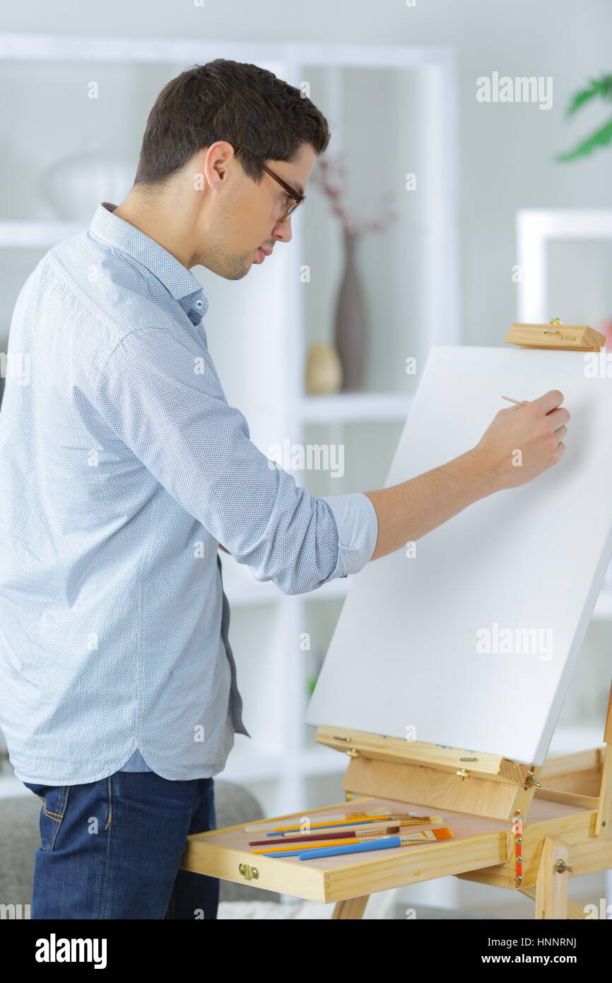 contemplative male artist painting Stock Photo - Alamy