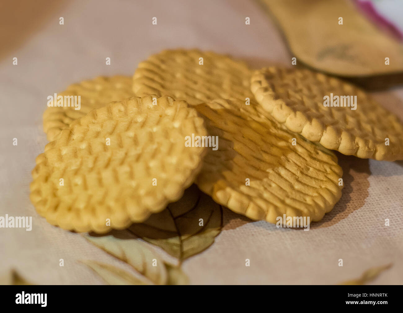 A lot of yellow tasty cookies on the table closeup Stock Photo - Alamy