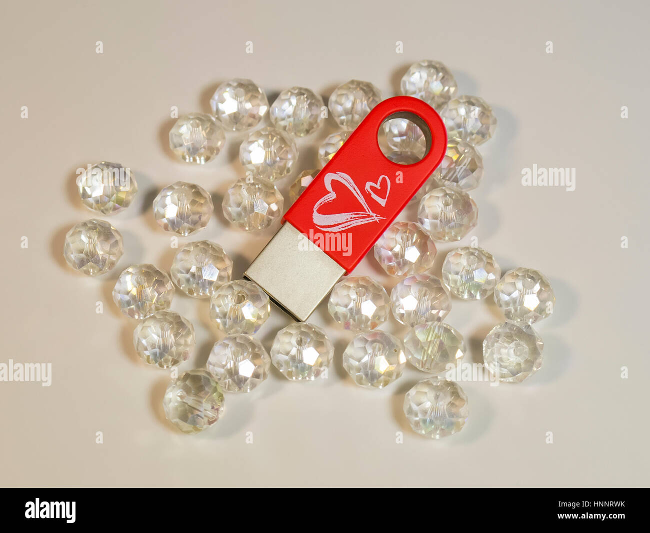 The red USB flash drive with heart and gems Stock Photo - Alamy