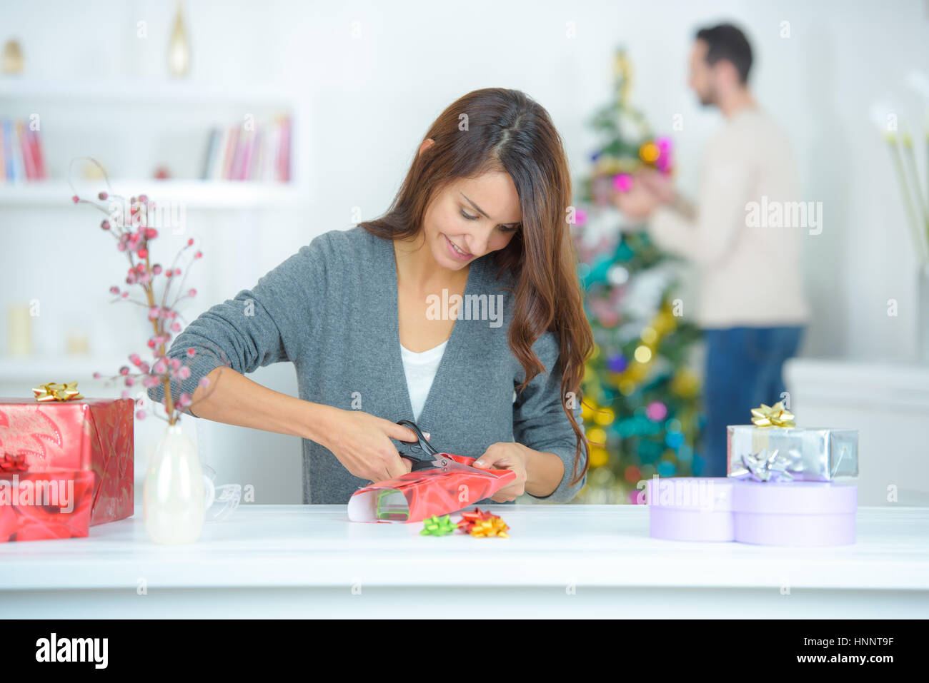 Woman wrapping christmas presents Stock Photo - Alamy