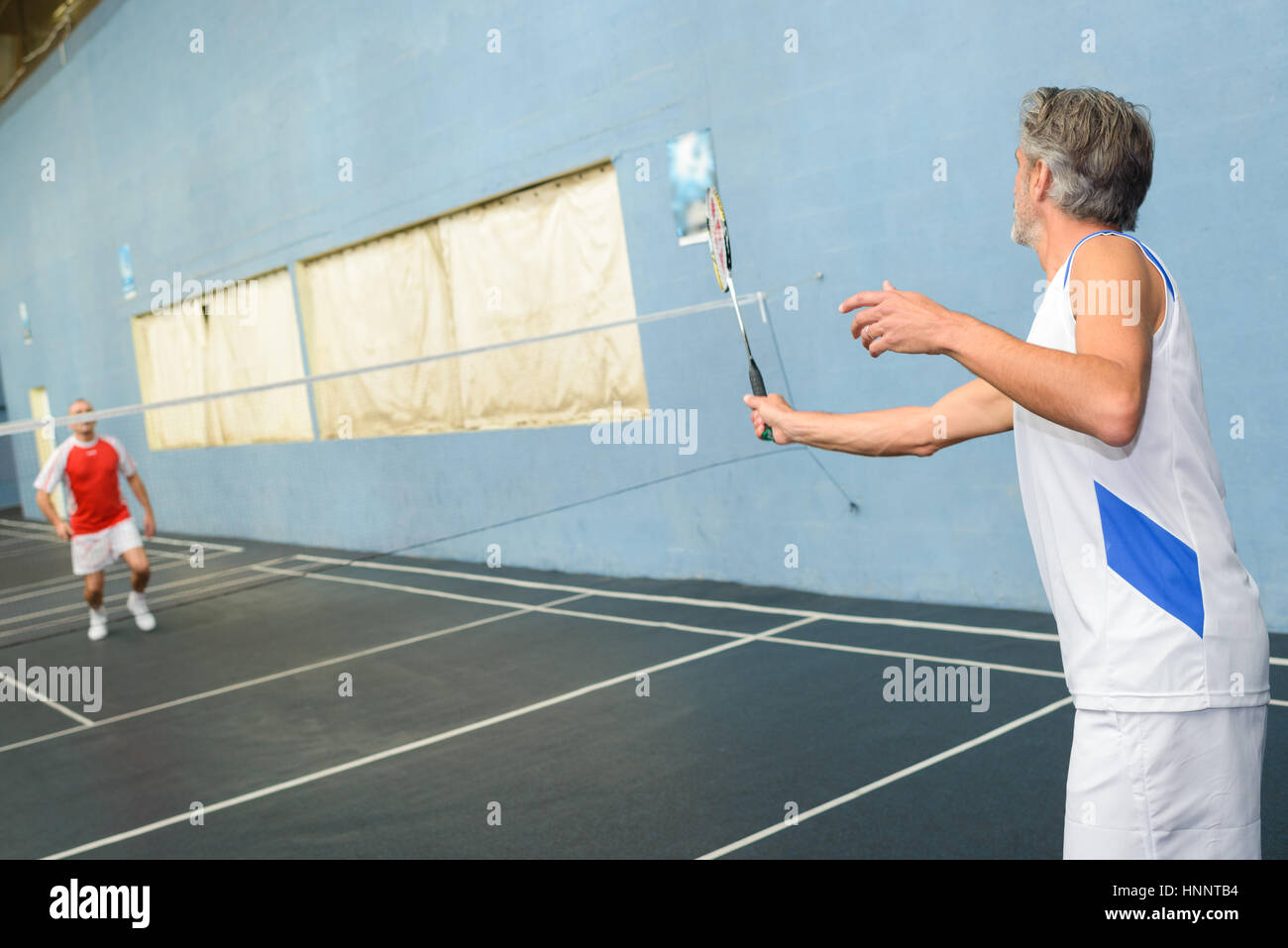 Men playing badminton Stock Photo - Alamy