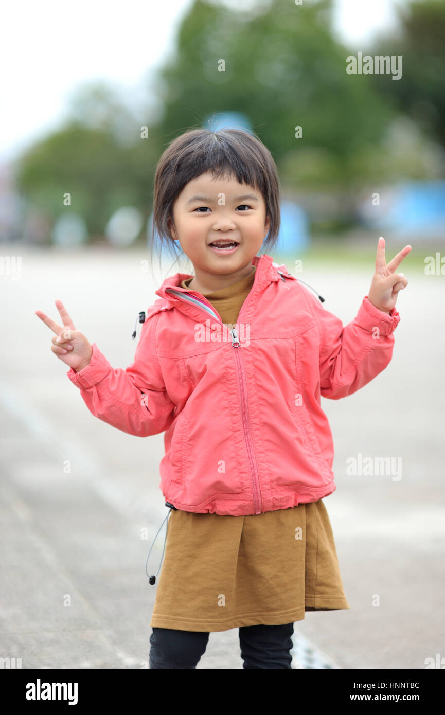 A girl with v sign Stock Photo - Alamy