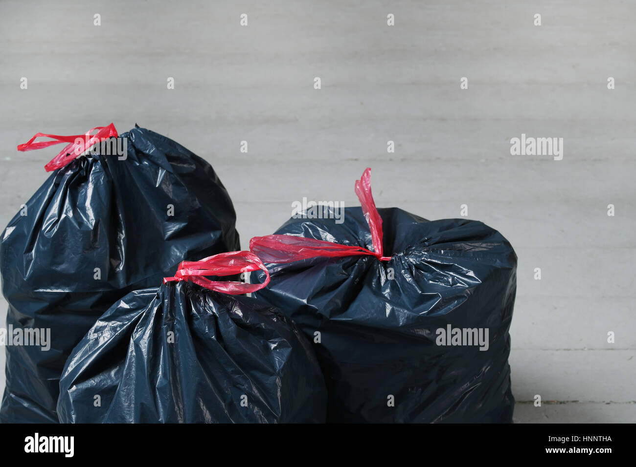 Pollution. Trash bags on the floor Stock Photo - Alamy