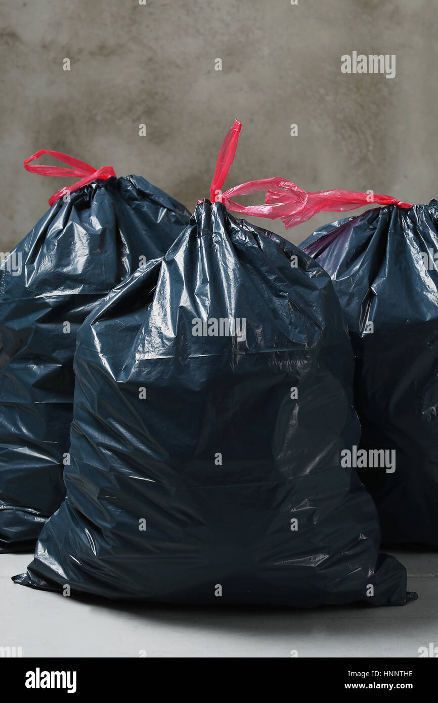 Pollution. Trash bags on the floor Stock Photo - Alamy
