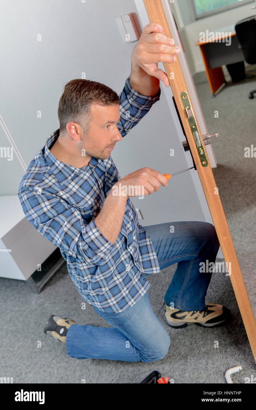 man repairing door lock Stock Photo - Alamy