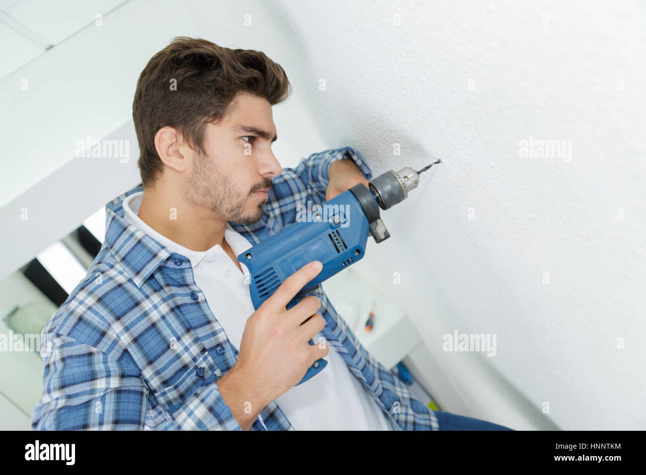 Handy man drilling hi-res stock photography and images - Alamy