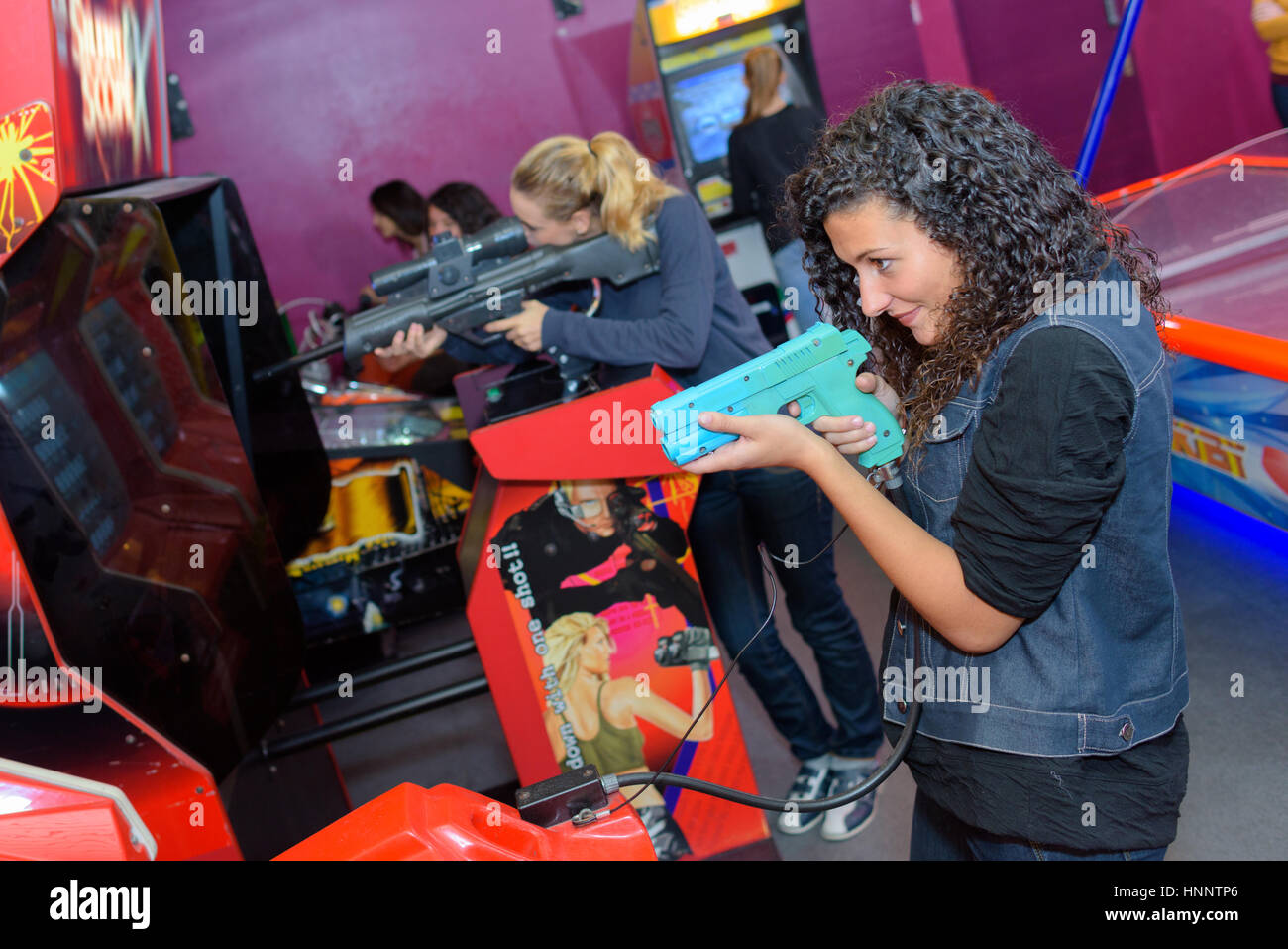 girls at the amusement arcade Stock Photo - Alamy