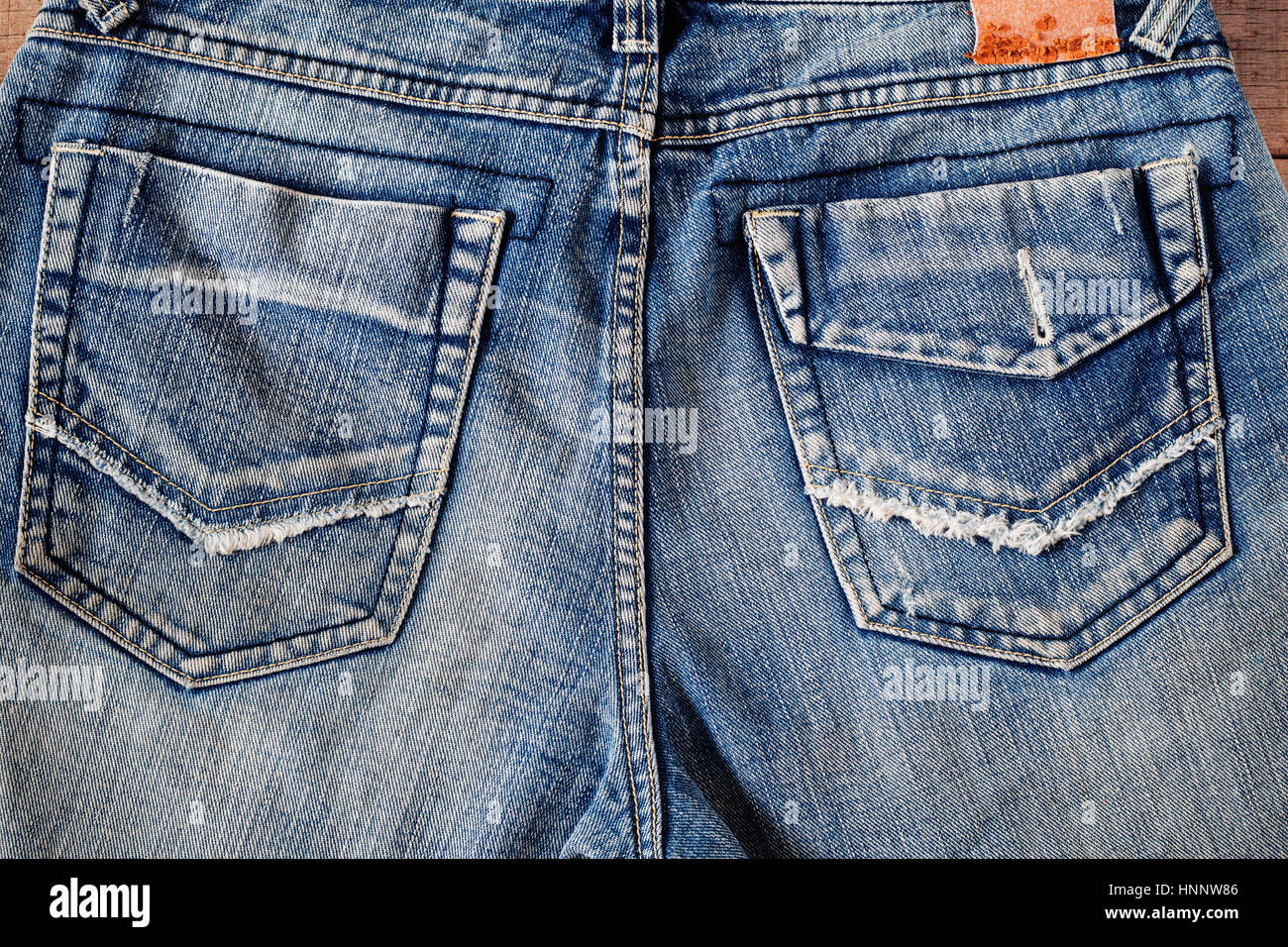 The rear surface of old jeans Stock Photo - Alamy