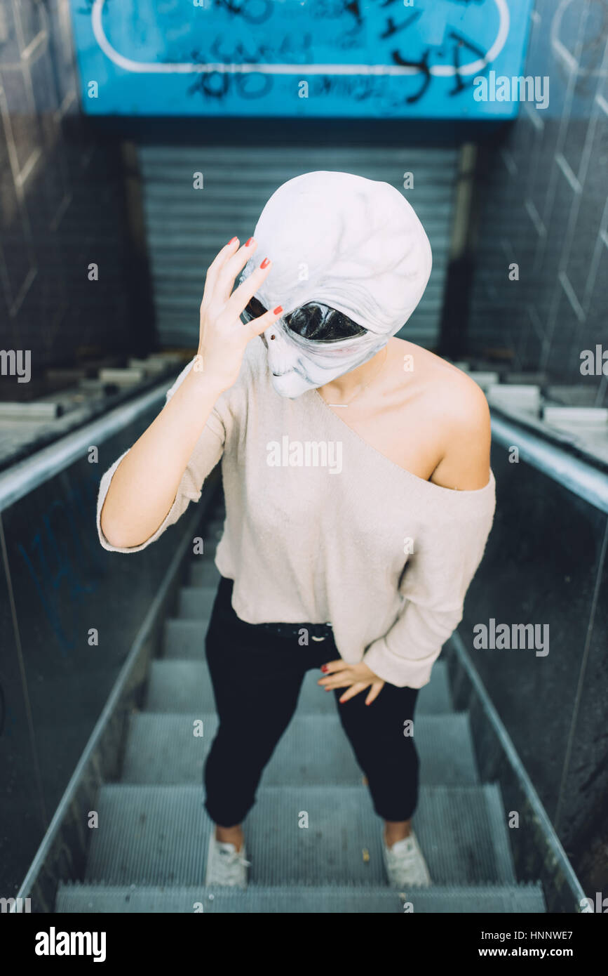 Young woman wearing alien mask - extraterrestrial, strange, alien ...