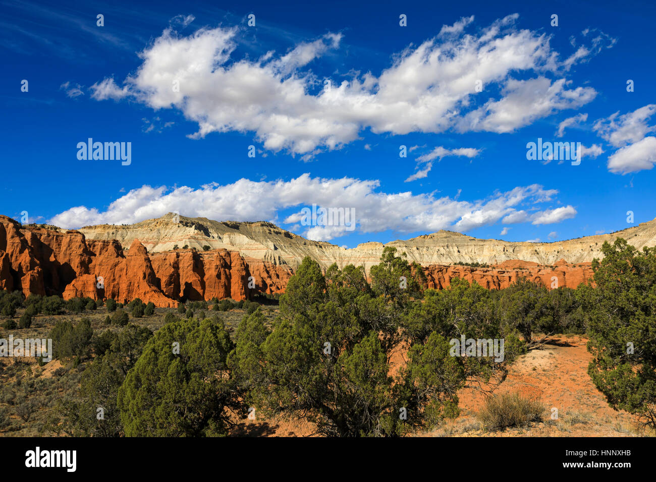 This is a wide view of the red rock and tan-colored sandstone mountains ...