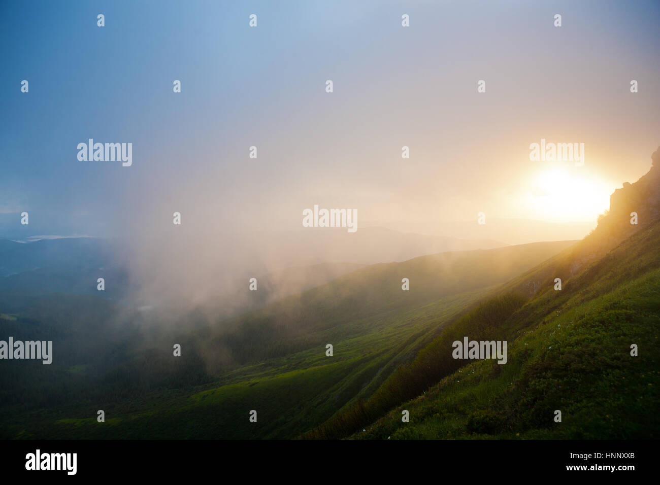 Sunrise in the fog near the mountain Goverla. Carpathians, summer ...