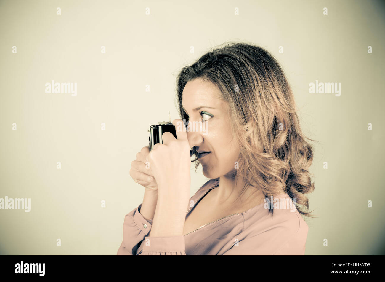 Female photographer using a retro camera from the 1920s Stock Photo - Alamy
