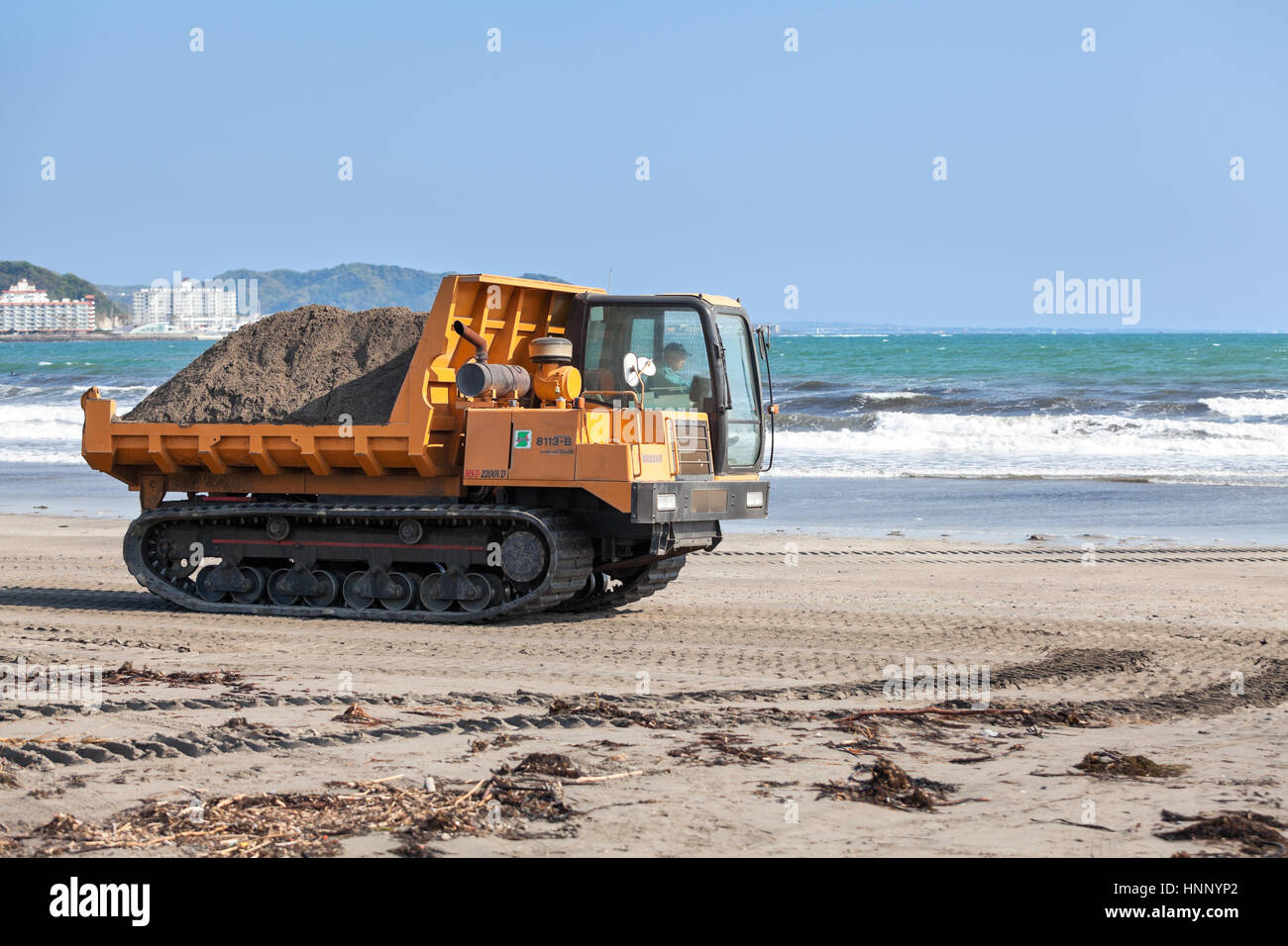 KAMAKURA, JAPAN - CIRCA APR, 2013: Crawler transporter full of sand ...