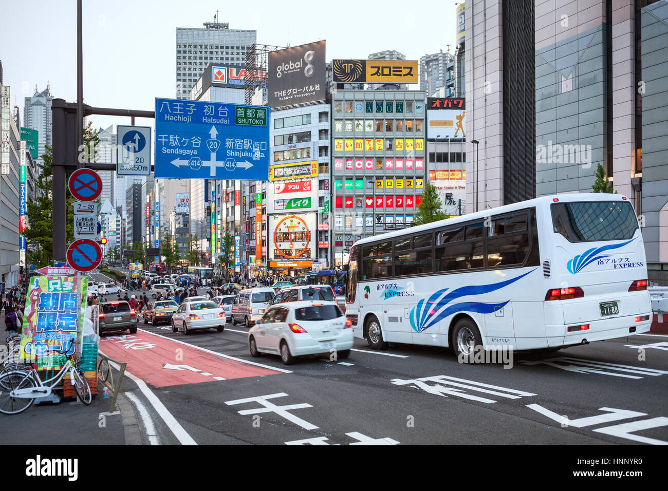 TOKYO, JAPAN - CIRCA APR, 2013: Buses and cars drive on the road in ...