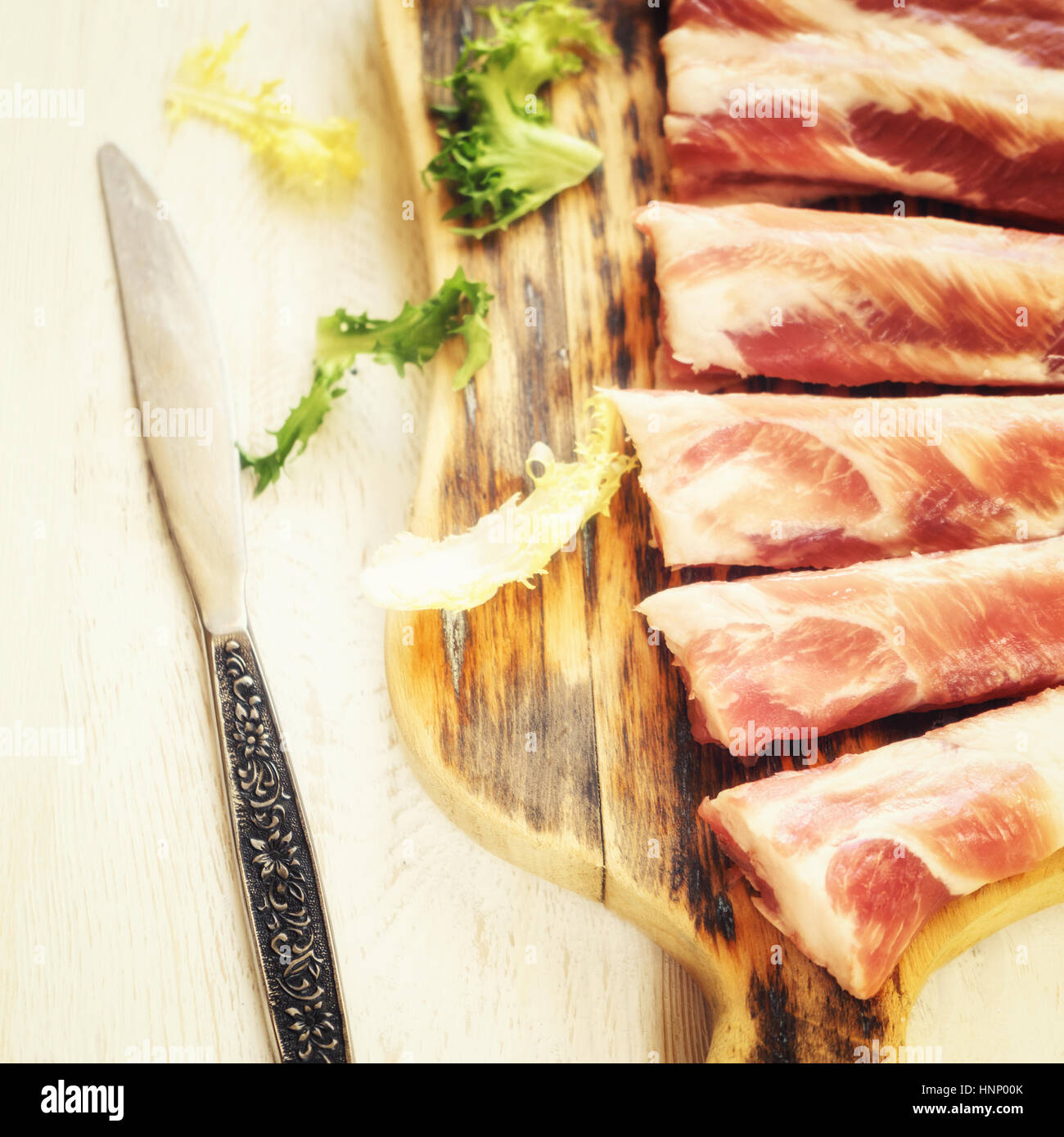 raw pork ribs on a cutting board, top view Stock Photo - Alamy